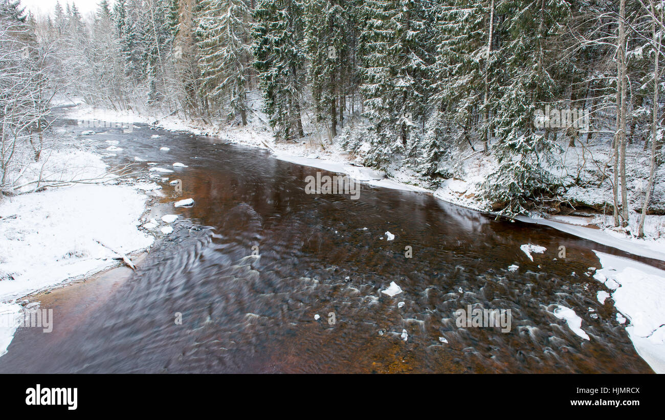Frozen winter river landscape with ice and snow Stock Photo - Alamy