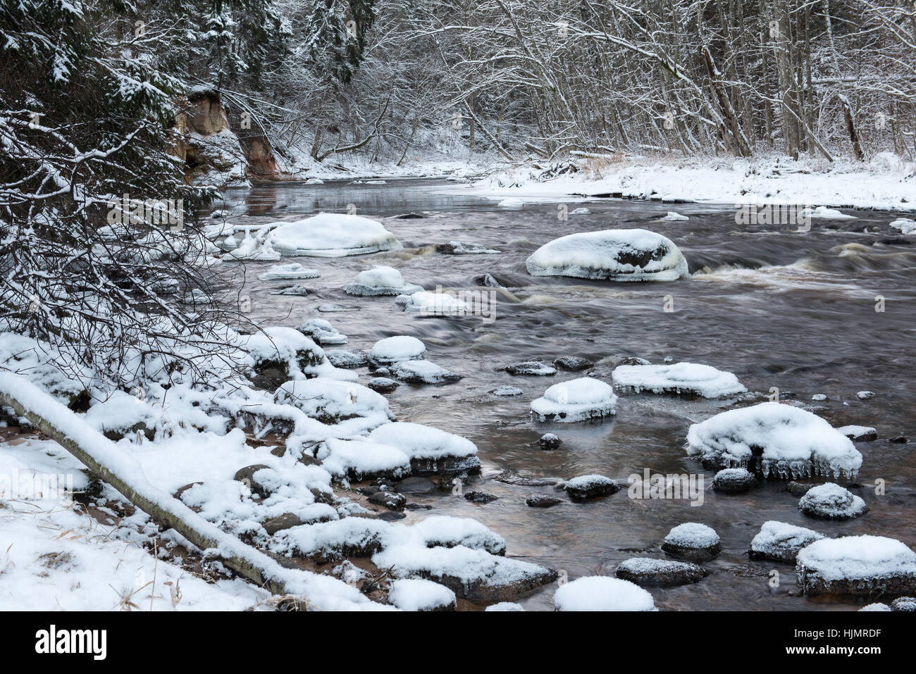 Frozen winter river landscape with ice and snow Stock Photo - Alamy