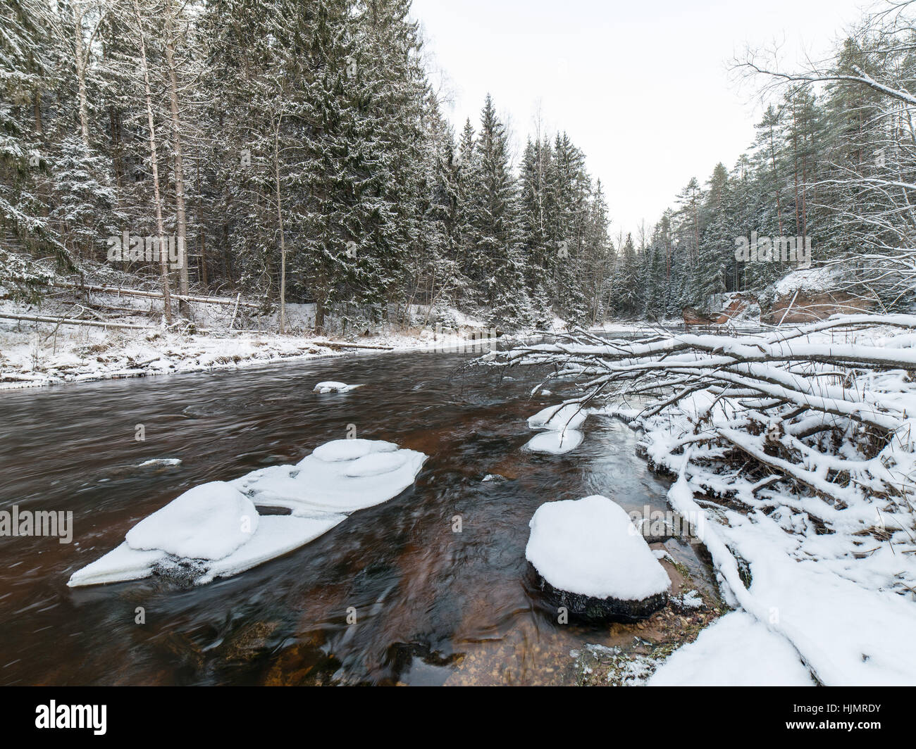 Frozen winter river landscape with ice and snow Stock Photo - Alamy