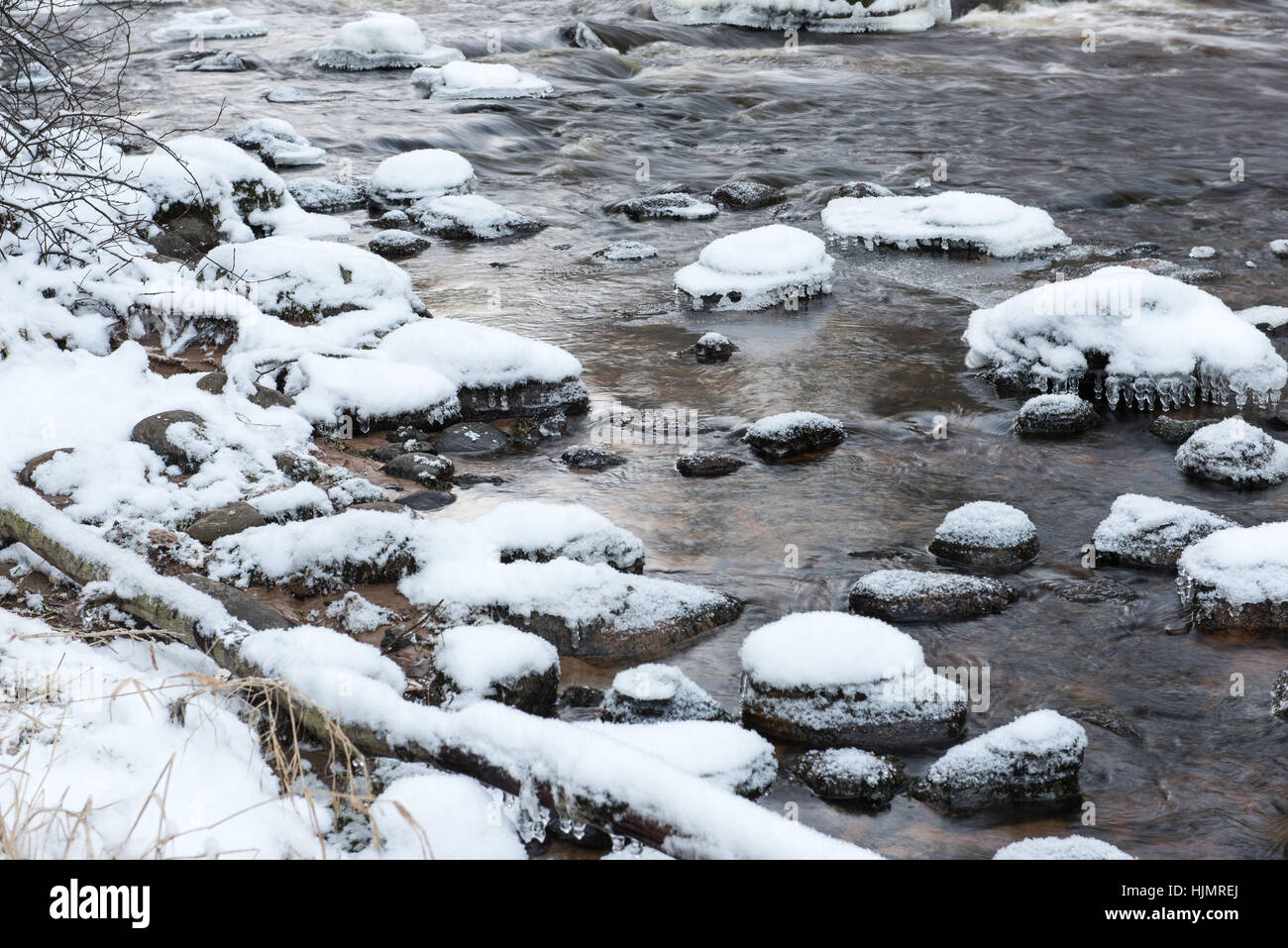 Frozen winter river landscape with ice and snow Stock Photo - Alamy