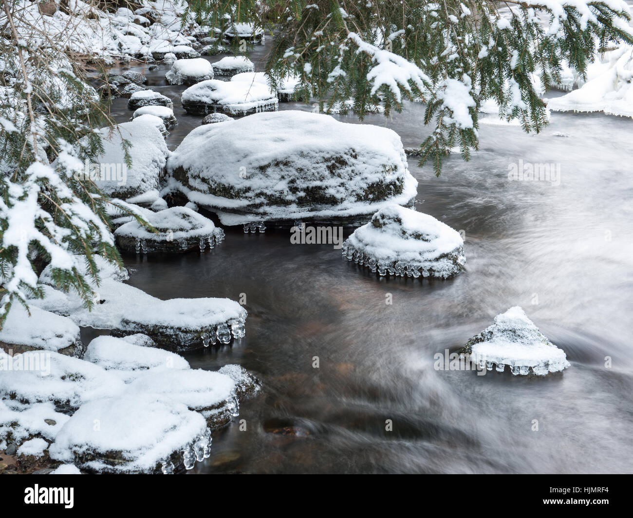 Frozen winter river landscape with ice and snow Stock Photo - Alamy