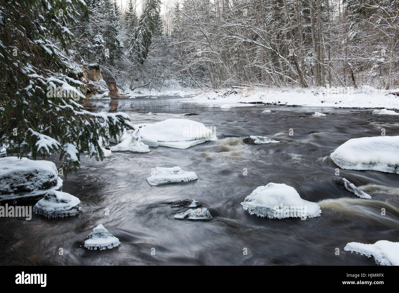 Frozen winter river landscape with ice and snow Stock Photo - Alamy