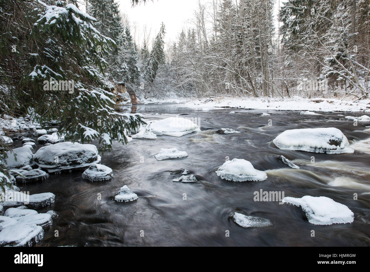 Frozen winter river landscape with ice and snow Stock Photo - Alamy
