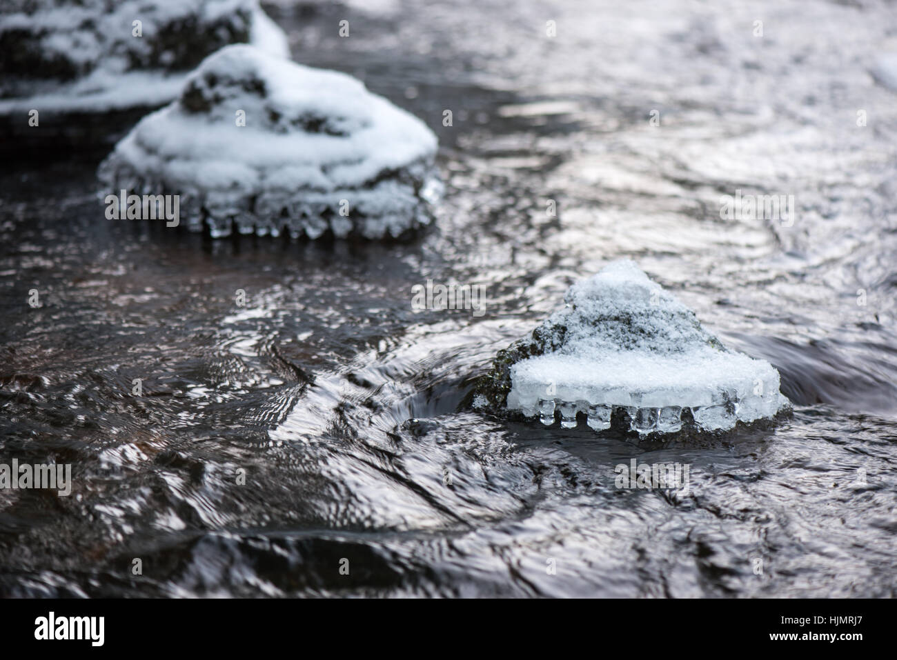 abstract frozen ice textures in the forest country river in winter ...