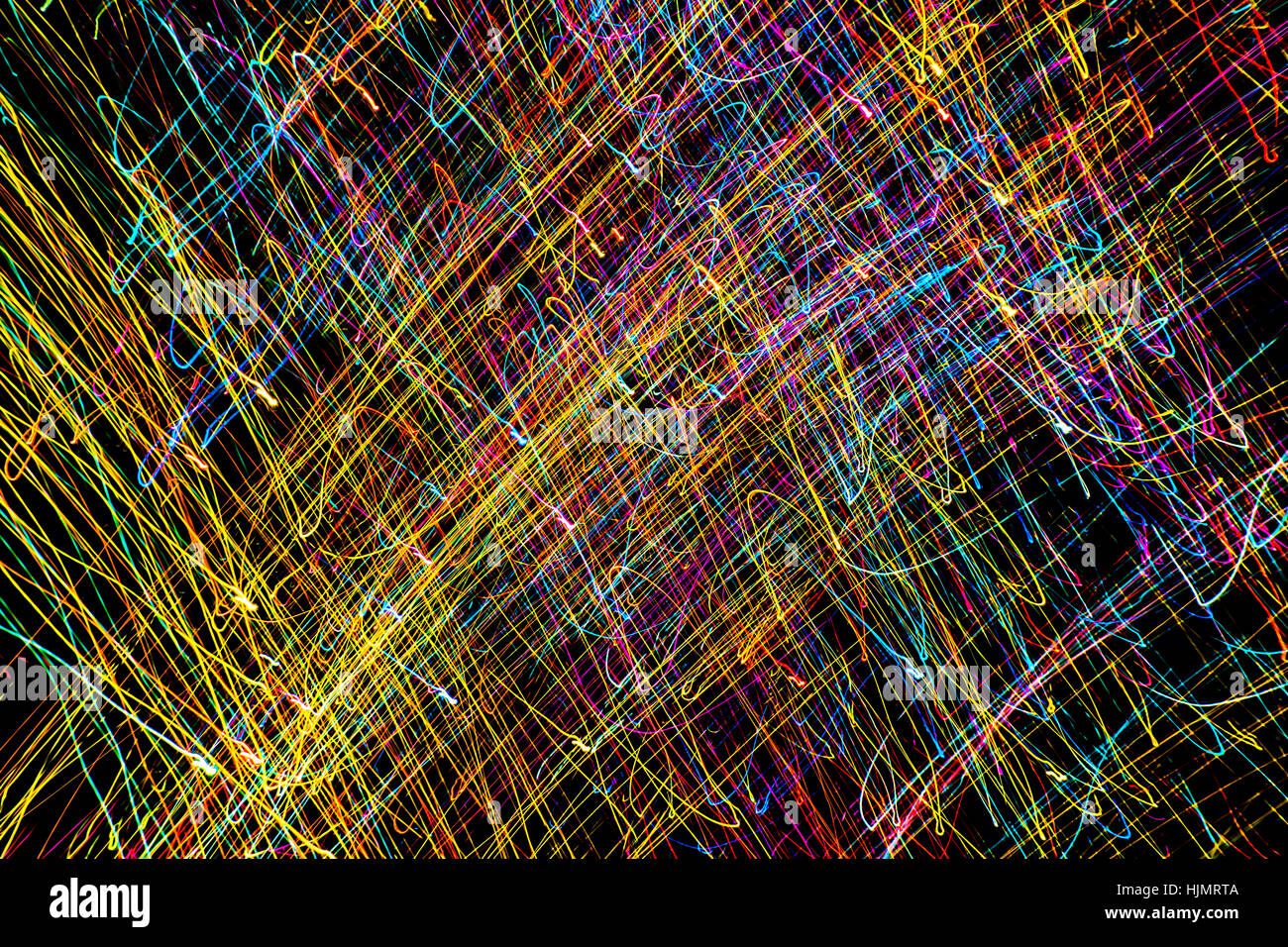 Colored glowing lines on dark background Stock Photo - Alamy