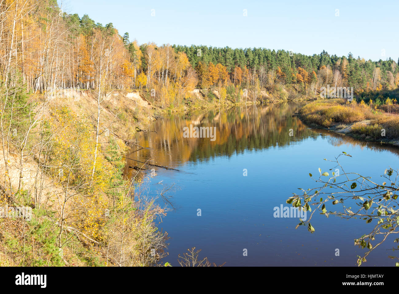 scenic autumn colored river in country with trees and reflections Stock ...