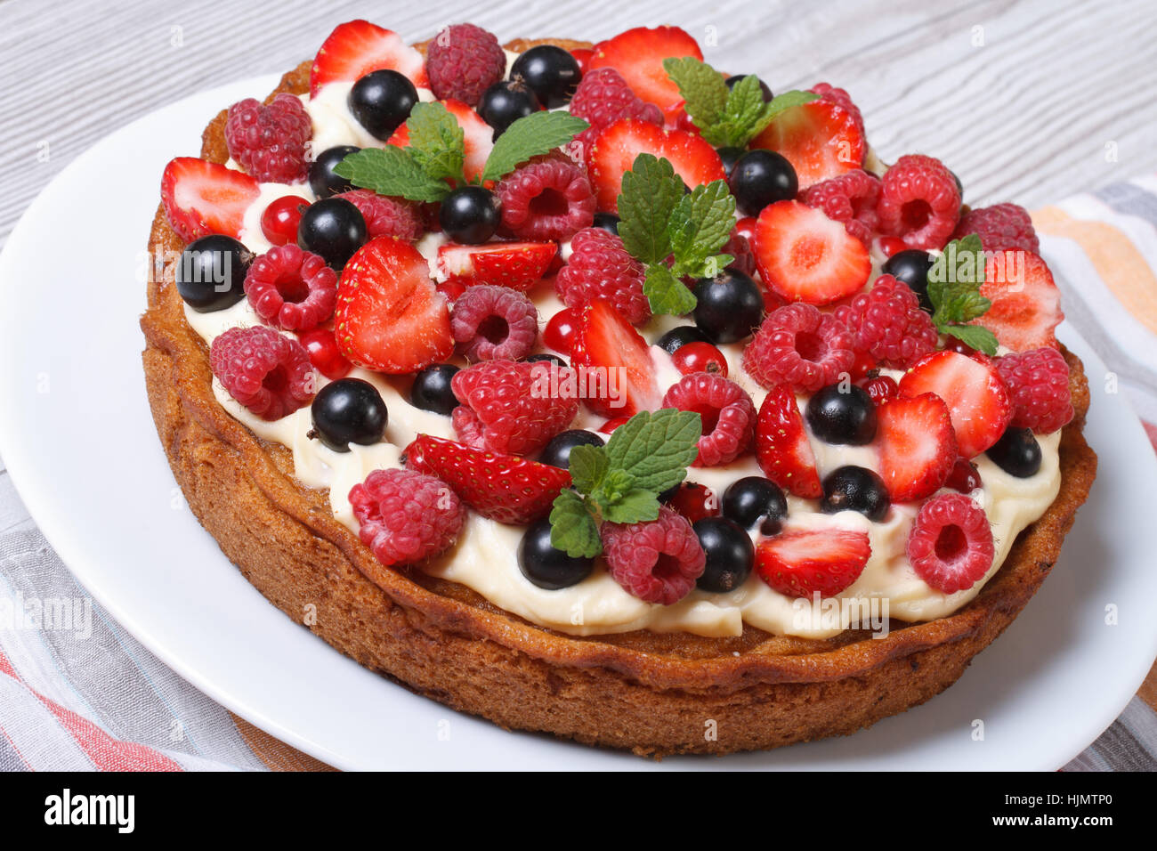 berry pie with fresh strawberries, raspberries, currants, mint and ...