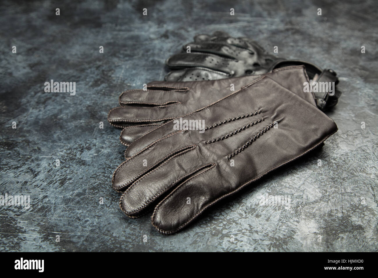 Two pairs of leather gloves Stock Photo - Alamy