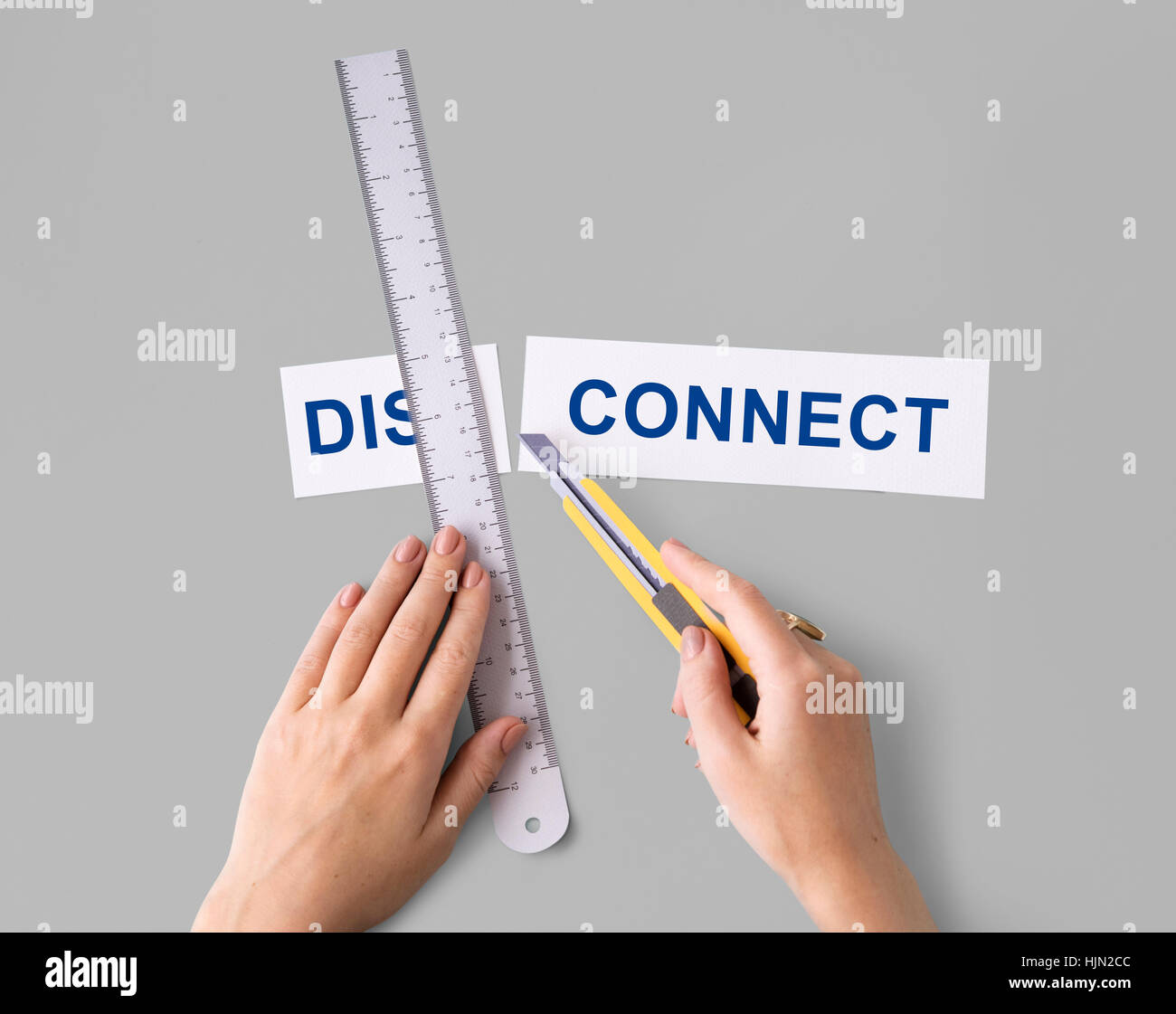 Disconnect Hand Cut Word Split Concept Stock Photo - Alamy