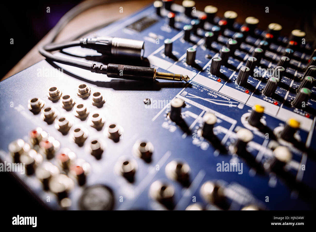 Close up shot of a mixer desk with many buttons and cables Stock Photo ...
