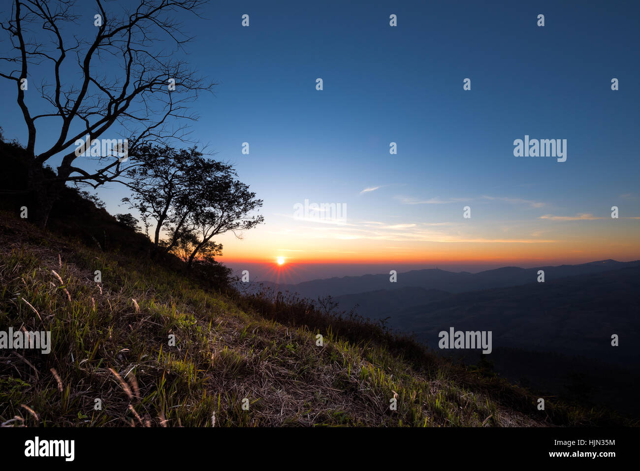 Good morning with sunlight on mountain. Morning sun shine with blue sky ...