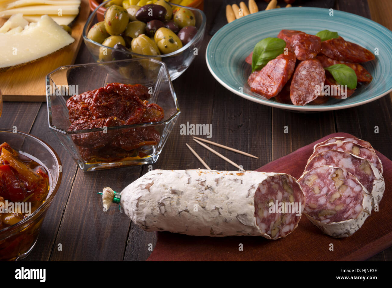 Variety of mediterranean starters - spanish tapas with salami sausage ...