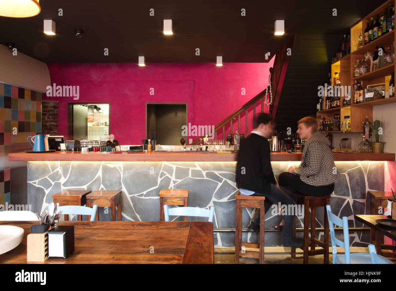 Interior of restaurant facing bar with patrons at bar. Radio Mexico ...