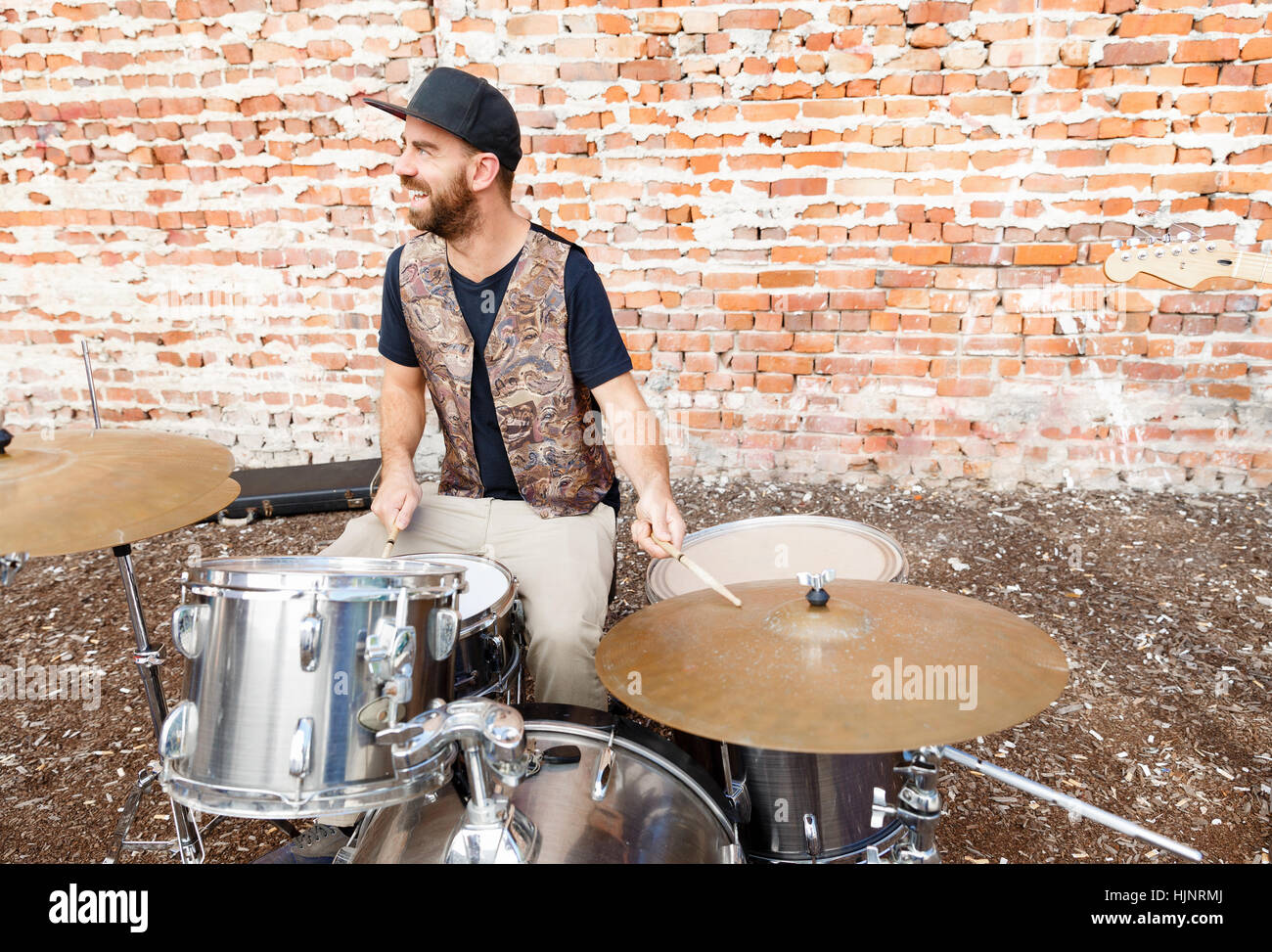 A street muscian playing drums Stock Photo - Alamy