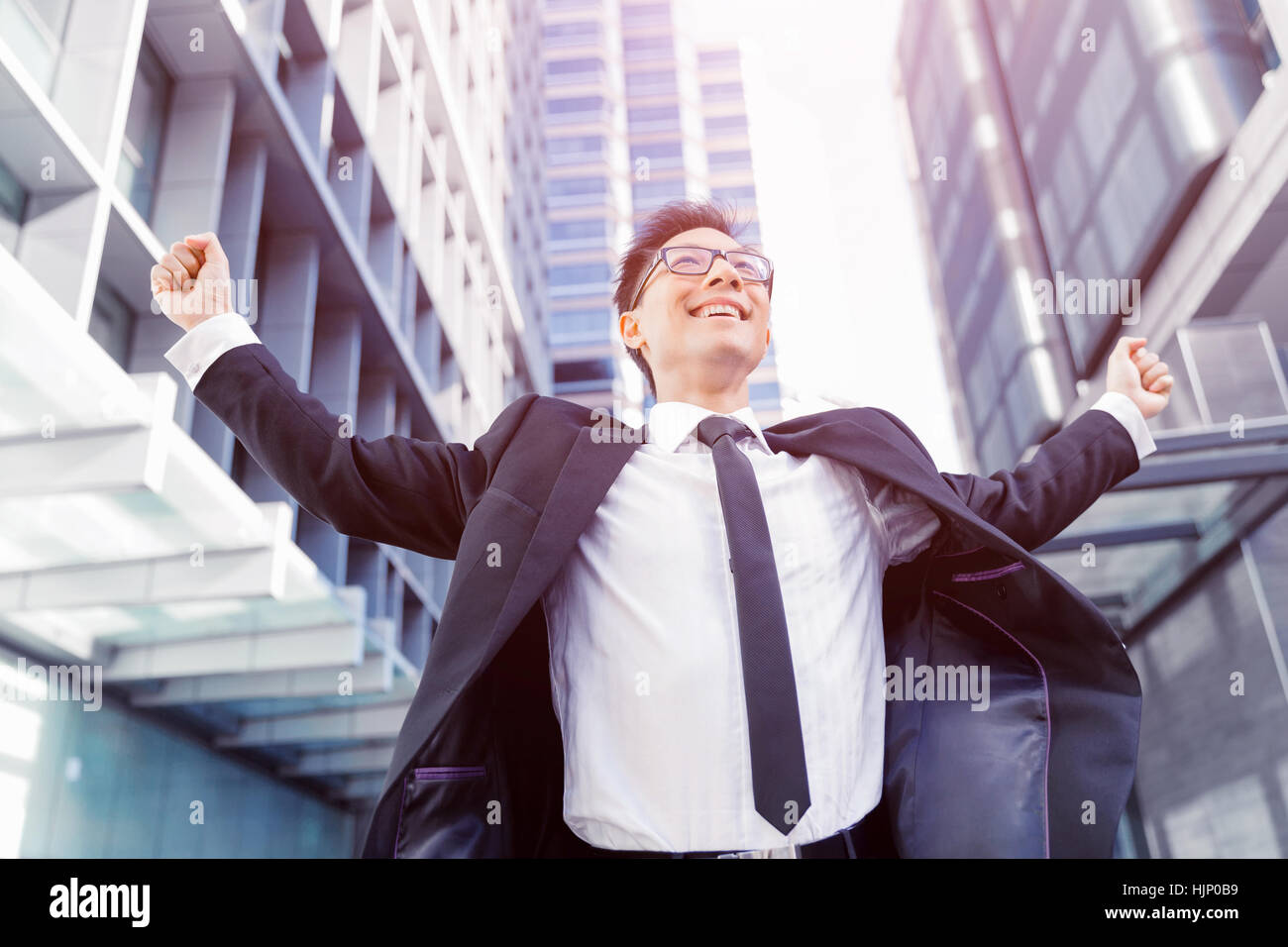 Businessman standing in street with his arms open hi-res stock ...