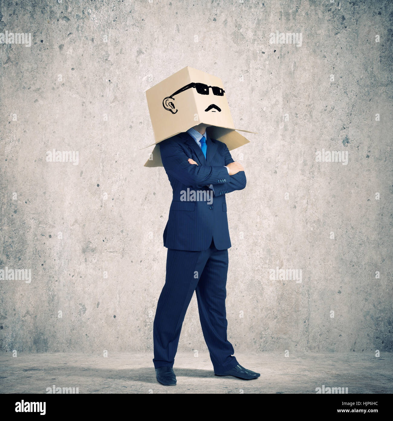 Businessman wearing carton box with smileys on head Stock Photo - Alamy