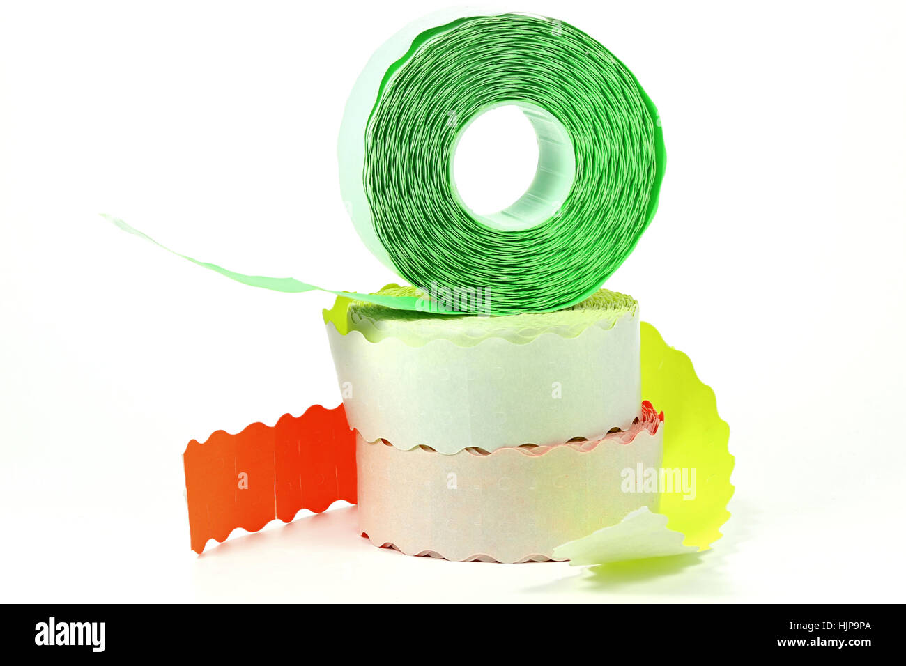 rolls of different colored price stickers isolated on white background ...