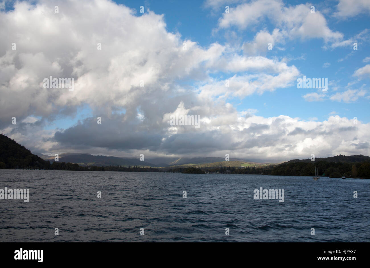 Storm clouds passing across the mountains to the north of Windermere ...