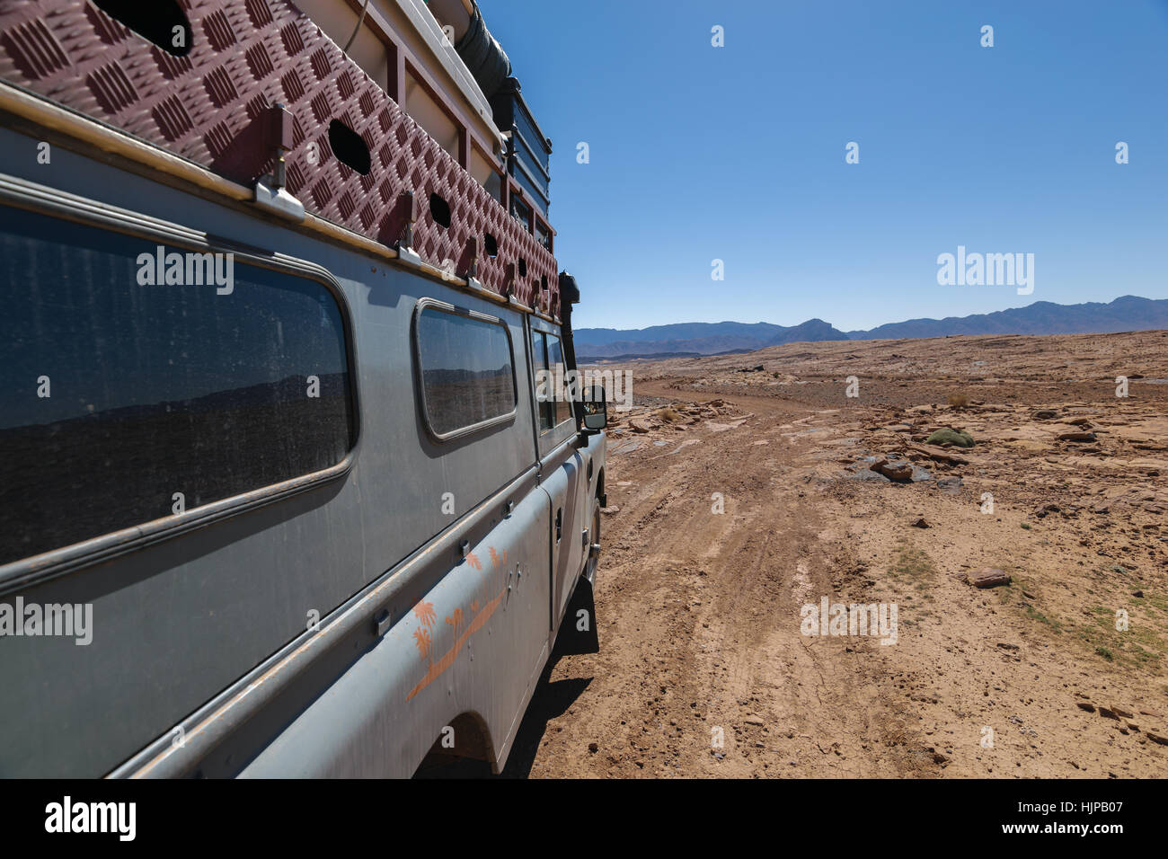 Four by 4 oldtimer driving off road in Morocco Stock Photo - Alamy