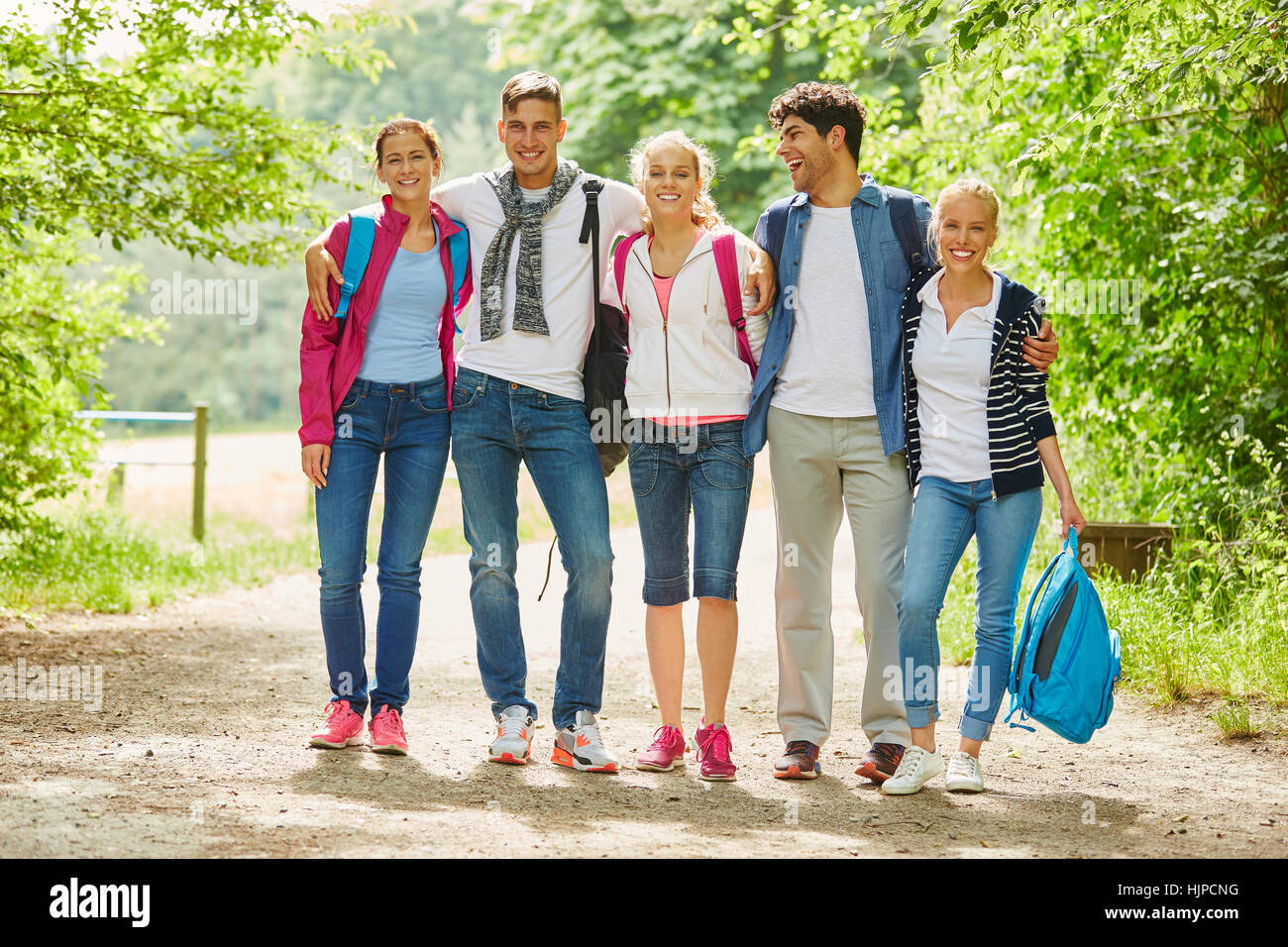 Hiking group together trekking in the nature Stock Photo - Alamy