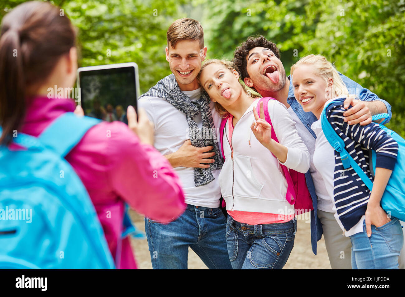 People being in silly for group photograph with teenager friends Stock ...