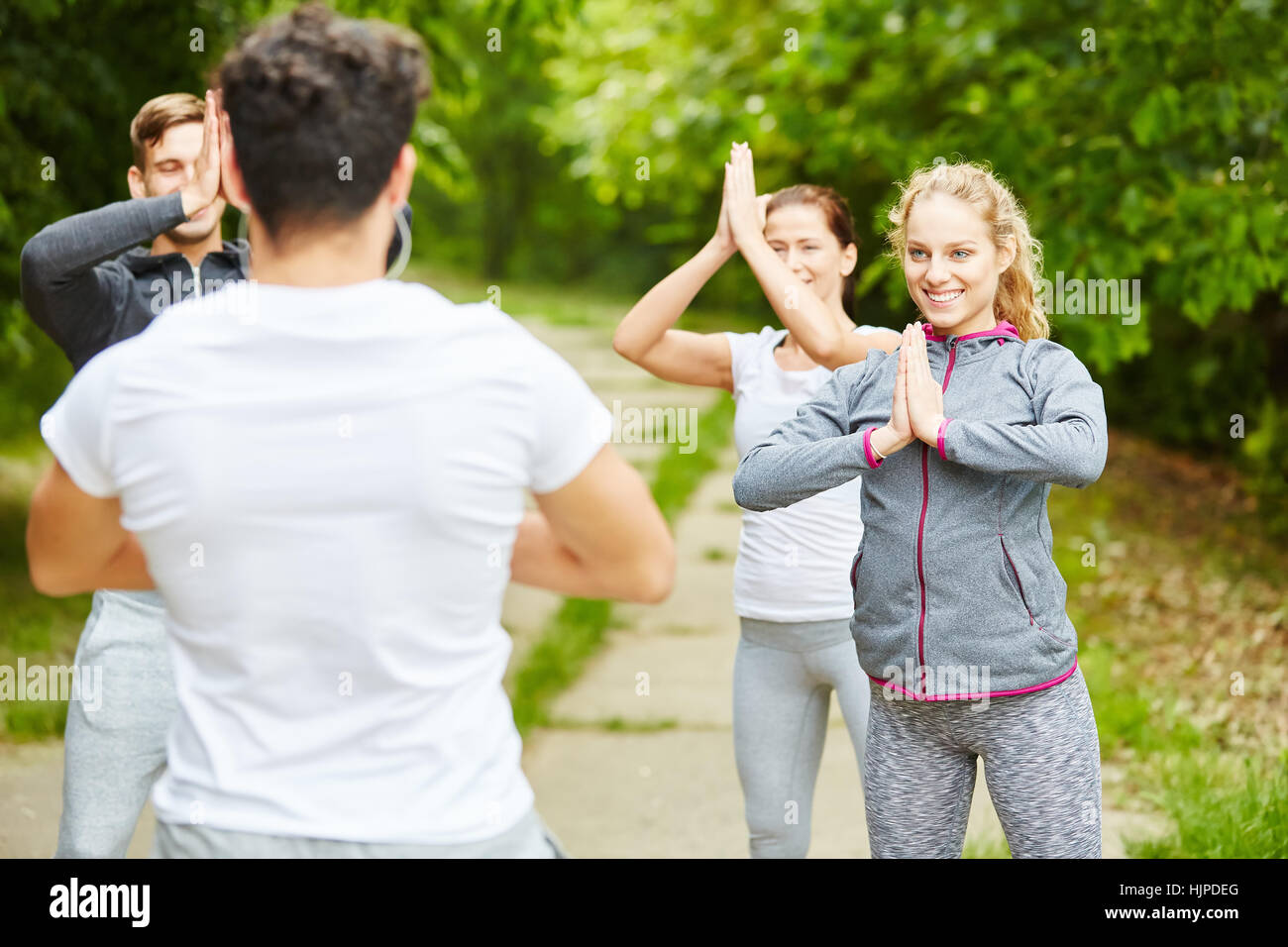 Group of young people training at the park Stock Photo - Alamy