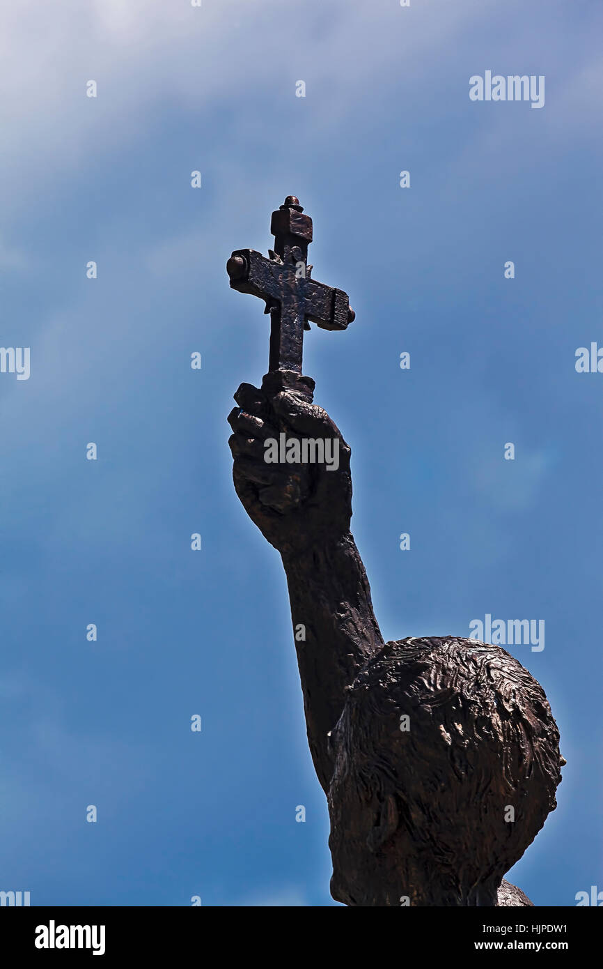 Christian monument in front of a cloudy sky Stock Photo - Alamy