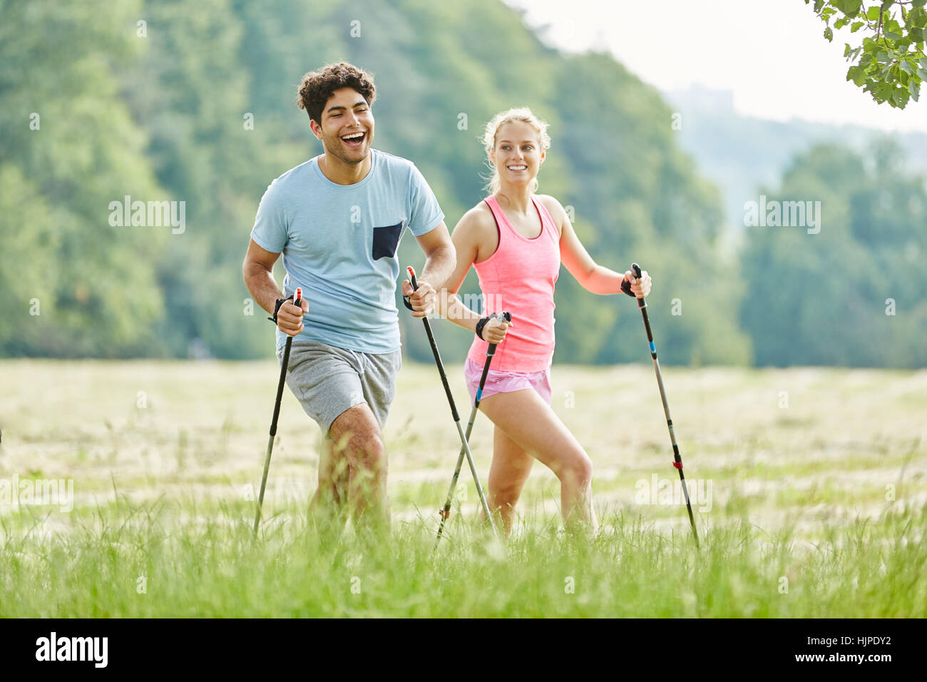 Young couple hiking and having fun in the nature Stock Photo - Alamy