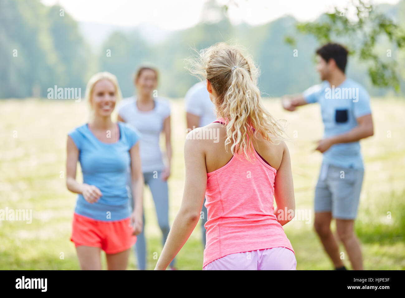People from sport club playing together with hula hoops Stock Photo - Alamy