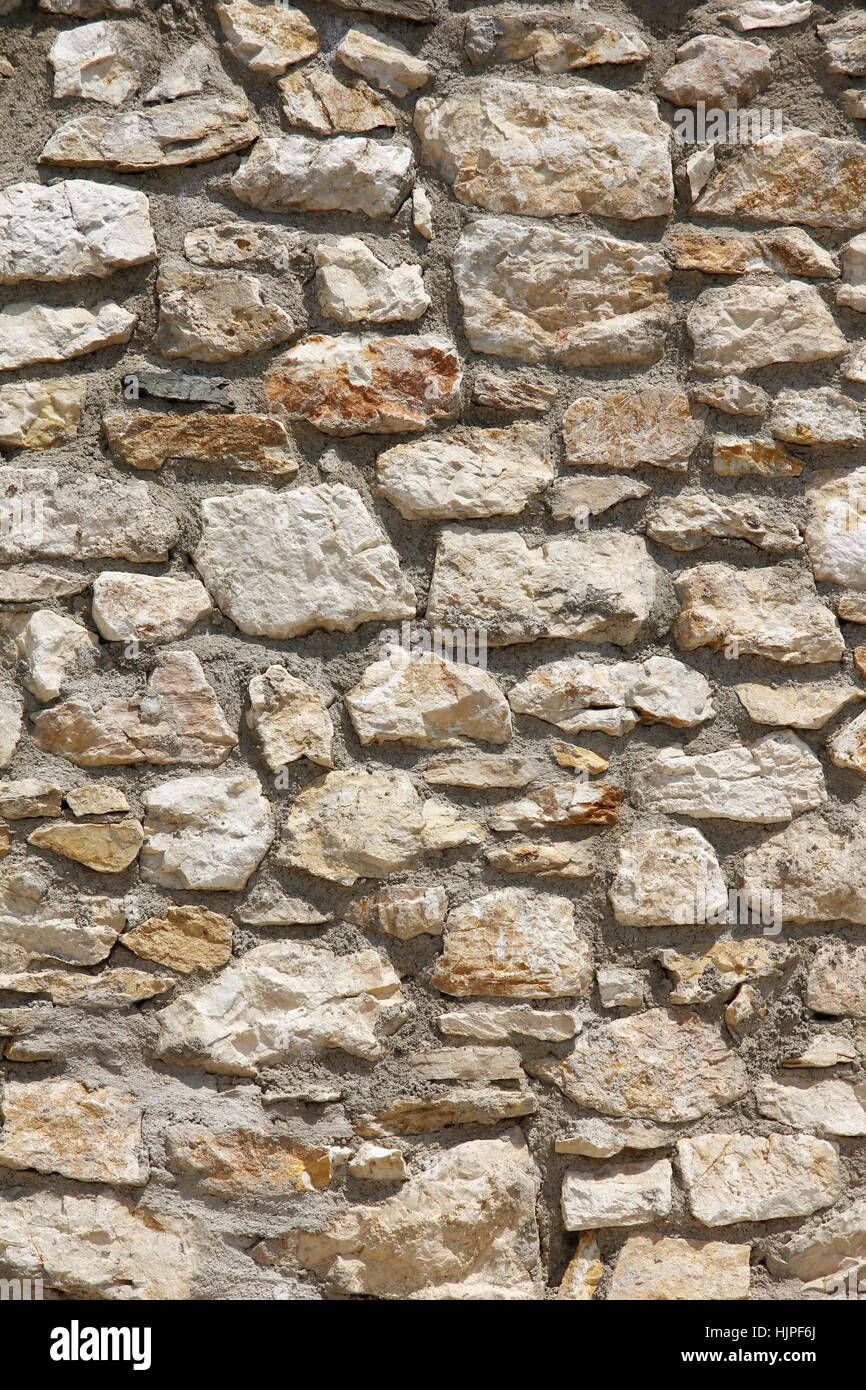 stone wall unplastered - natural stones Stock Photo - Alamy