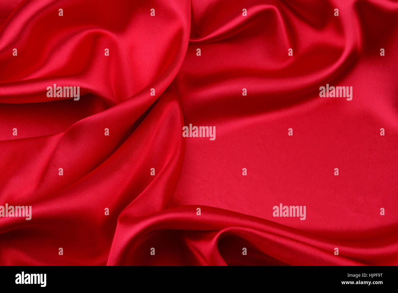 Closeup of ripples in red silk fabric Stock Photo - Alamy