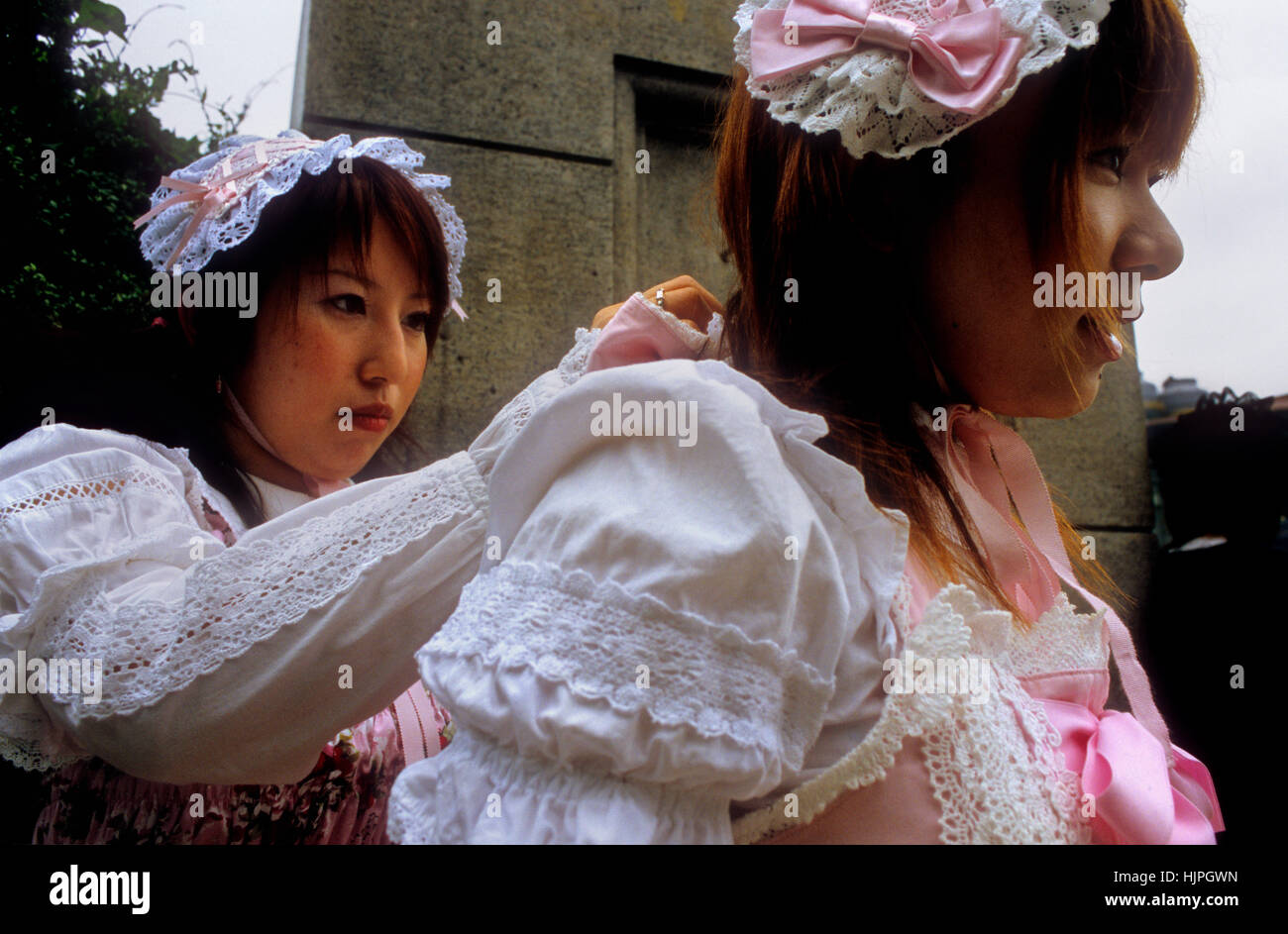 Cosplay, maid, maids, gothic lolitas.Harajuku bridge. Otakus.Teenagers dressed in a provocative ...