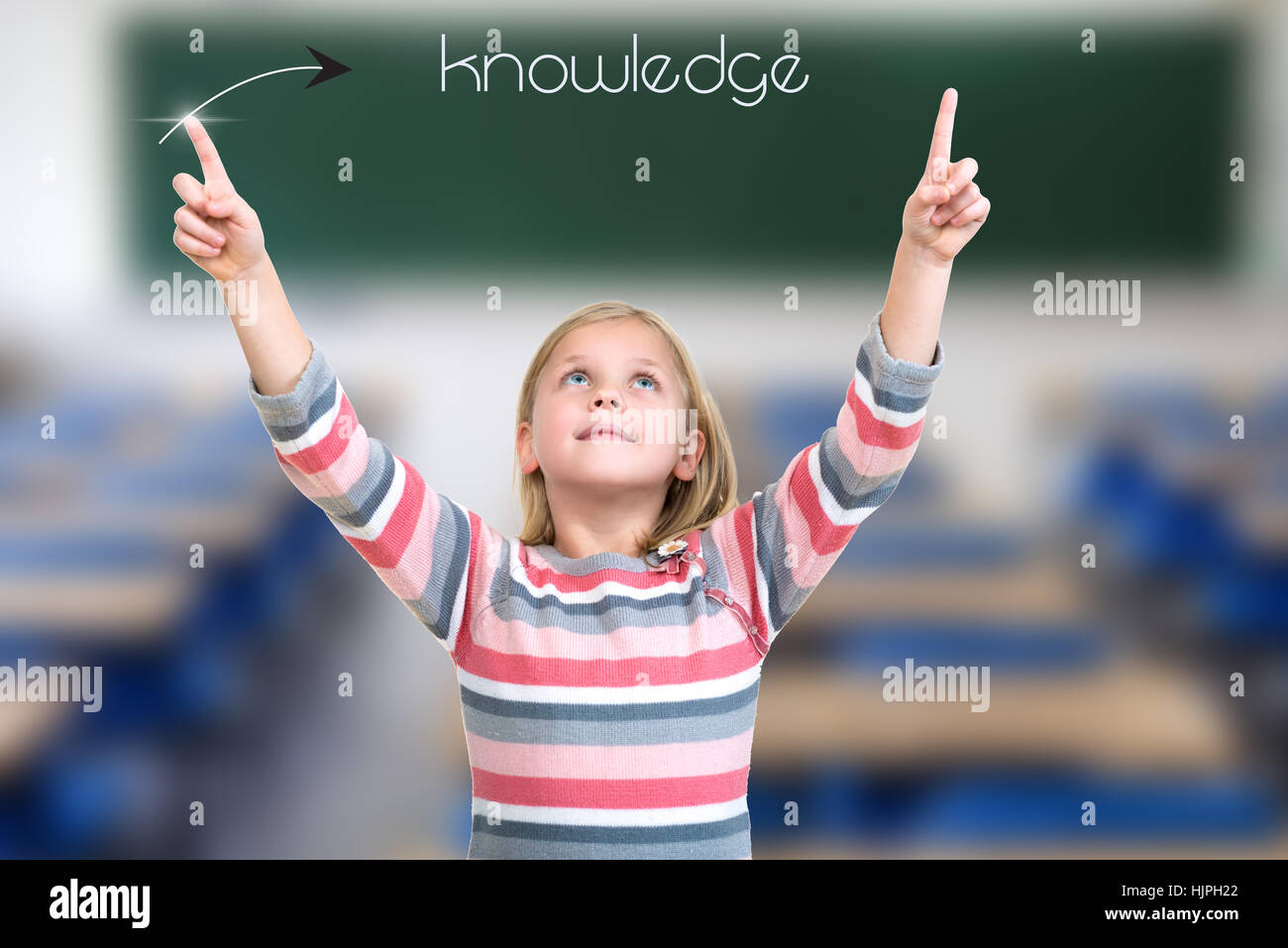Little girl pointing on knowledge sign with hand Stock Photo - Alamy
