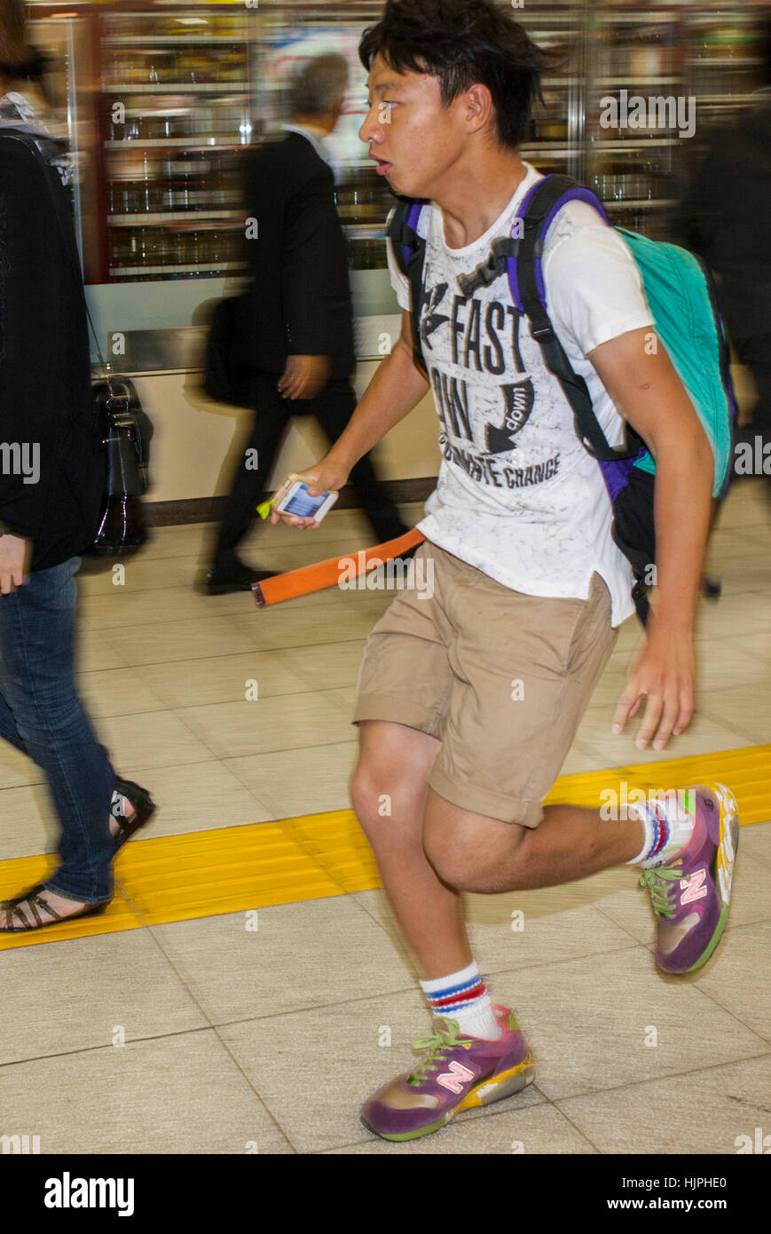 Boy, young, younger, running,in Shinjuku Railway station.Tokyo city ...