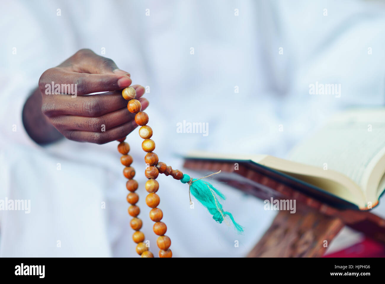 African Muslim Man Making Traditional Prayer To God While Wearing ...
