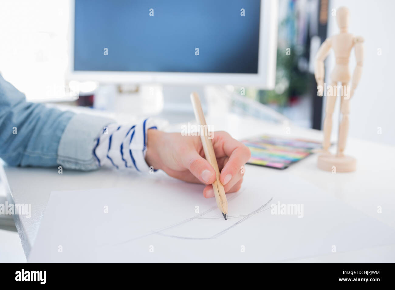 Female hands drawing with pencil on paper on her desk Stock Photo - Alamy