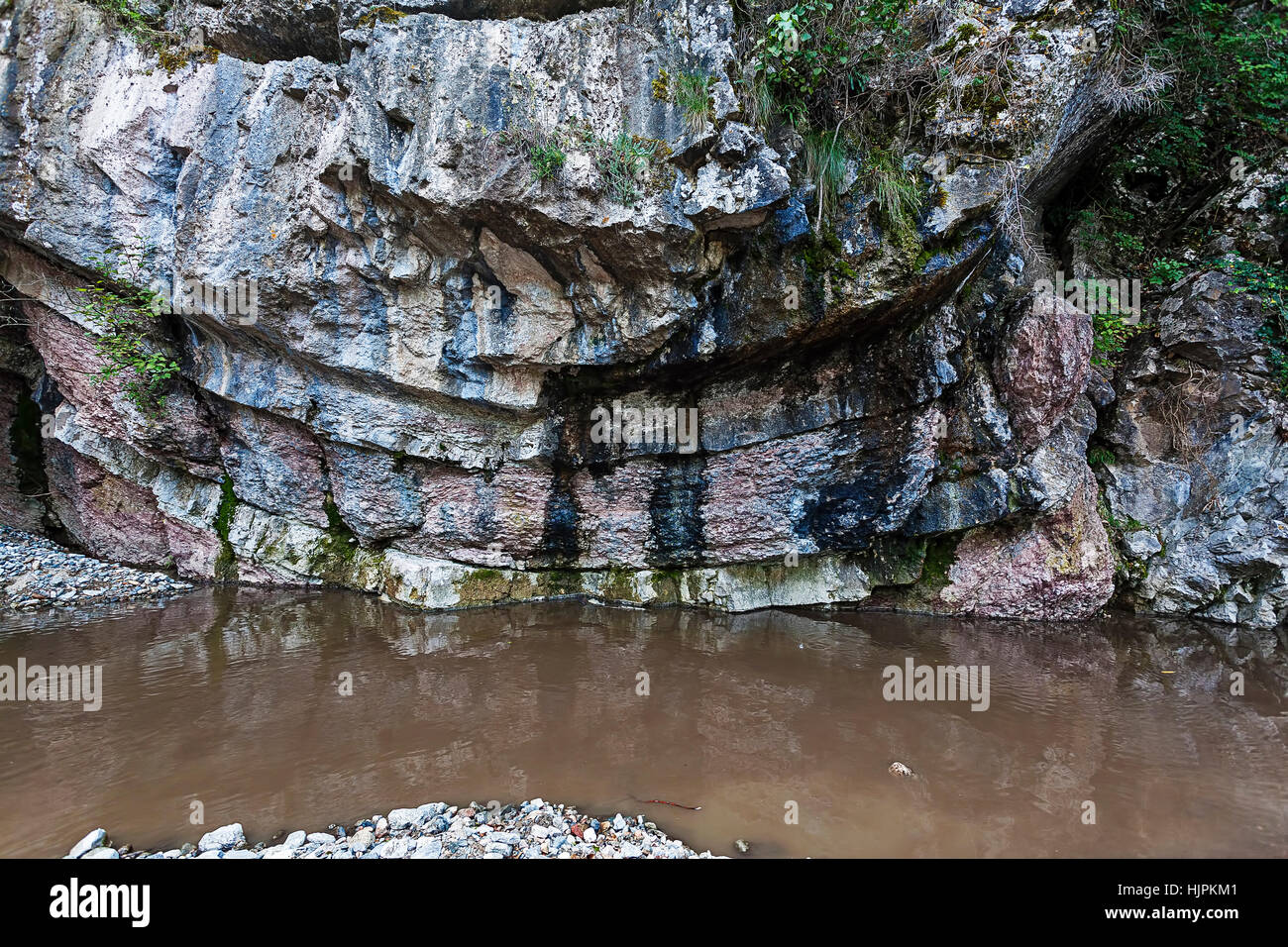 Multi-colored layered rock solid minerals Stock Photo - Alamy