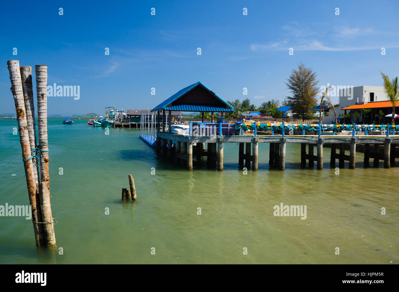 Bridge fishing pier extending into the sea Stock Photo - Alamy