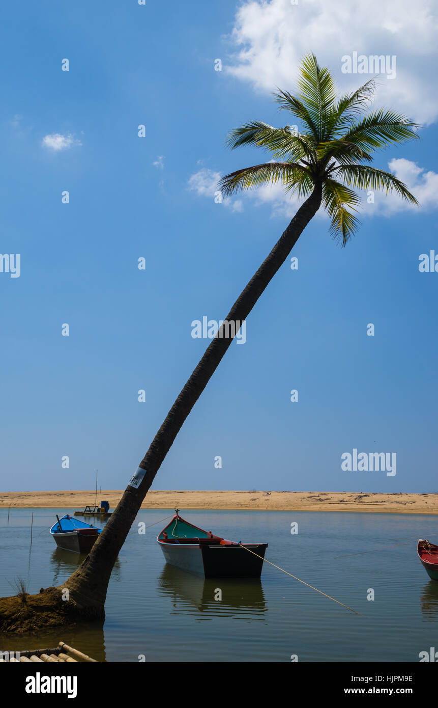 Boat at beach and blue sky Stock Photo - Alamy