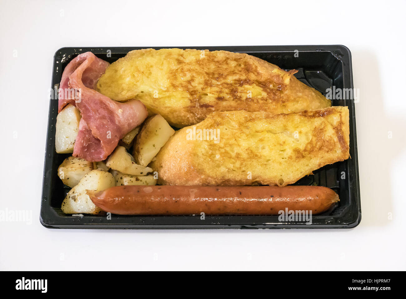 The delicious breakfast set on black plastic tray Stock Photo - Alamy