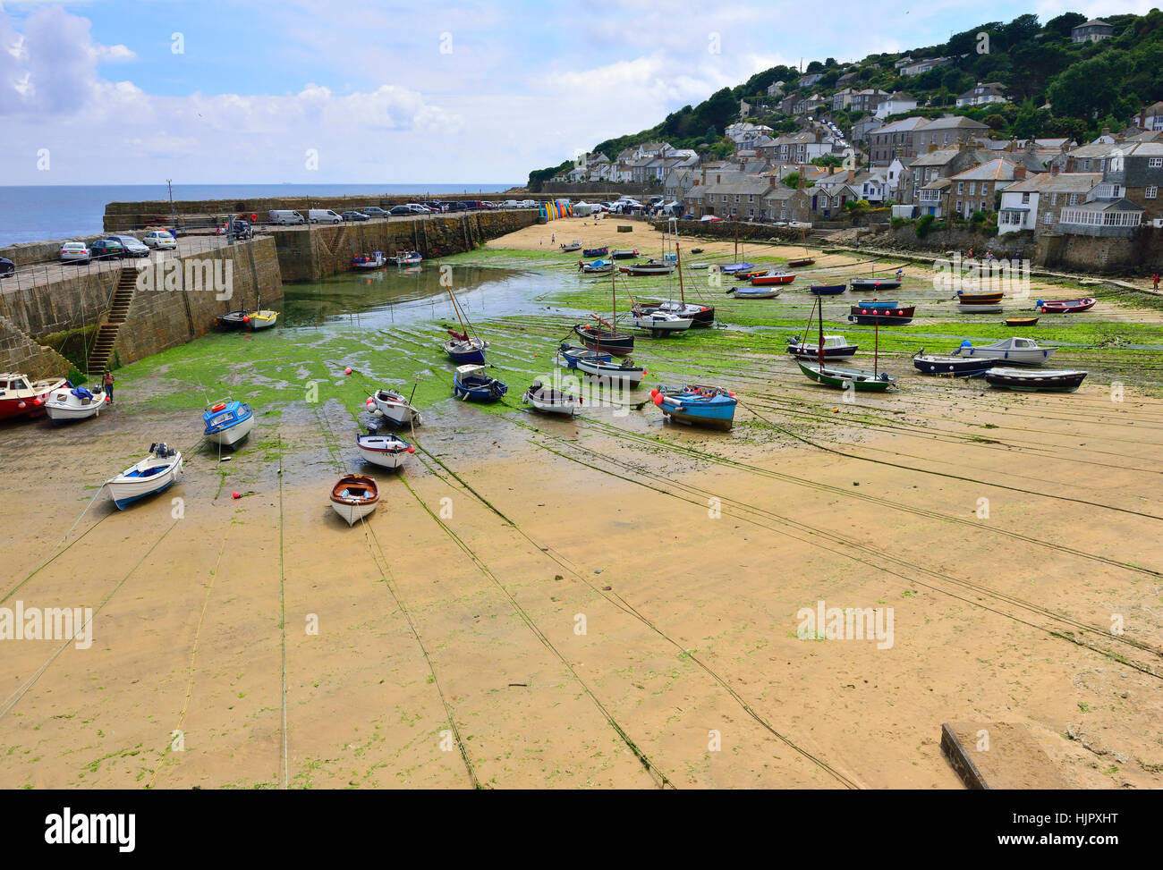 View at low tide of village and fishing port of Mousehole. Named ...