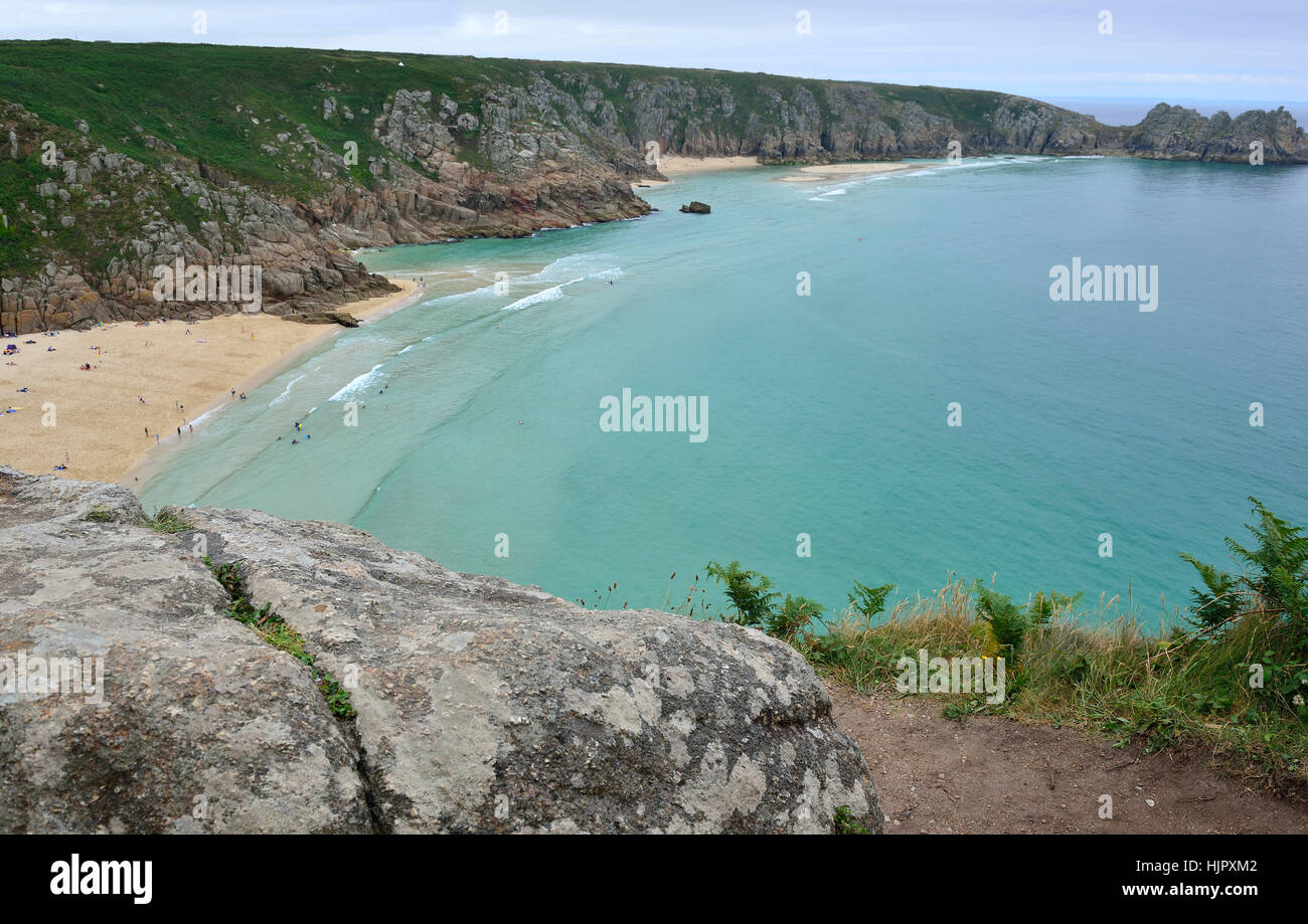 Porthcurno Beach and bay enclosed by the Logan Rock. Here the first ...