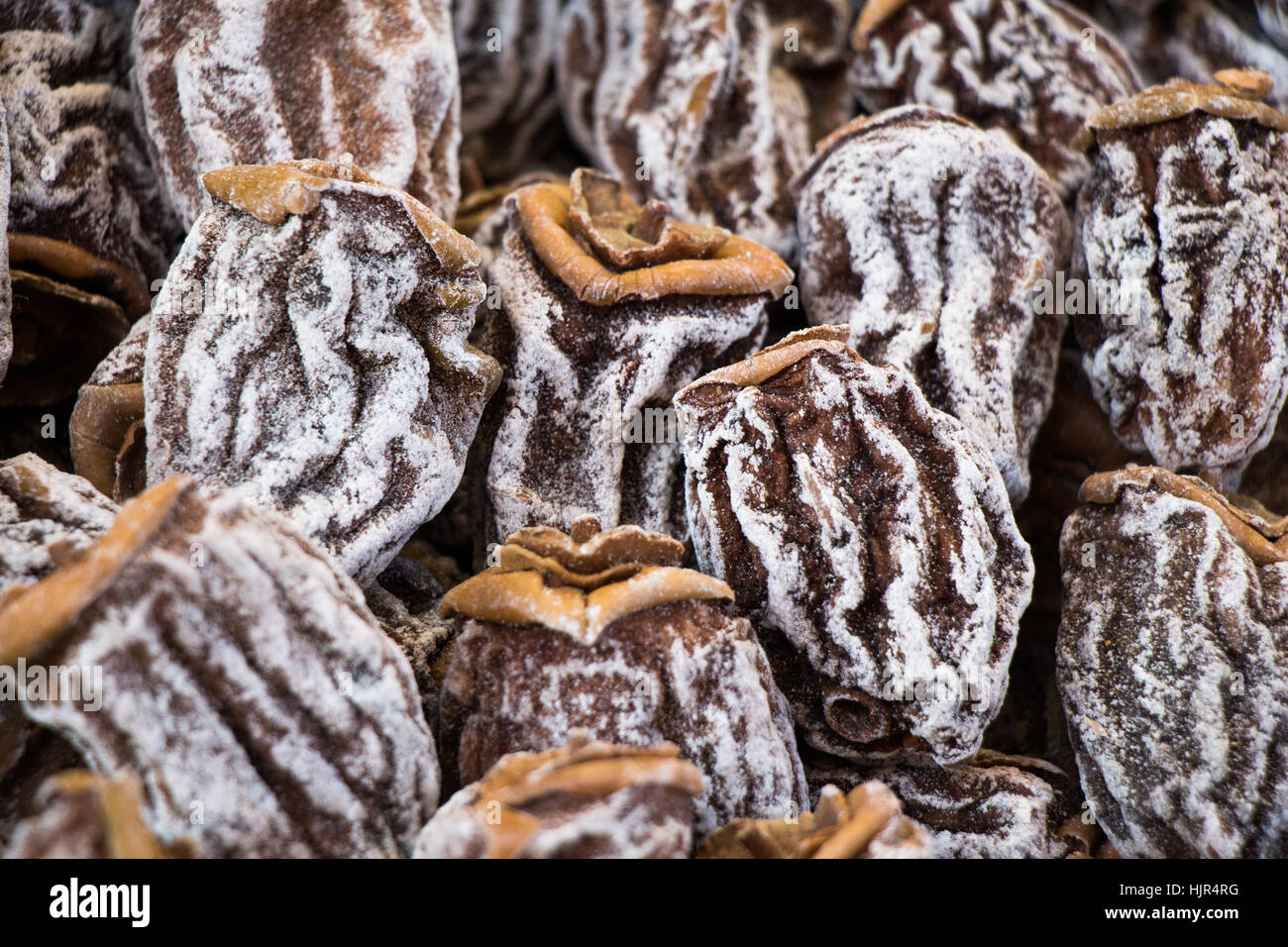 persimmon dry in the sun as a dry fruit Stock Photo - Alamy