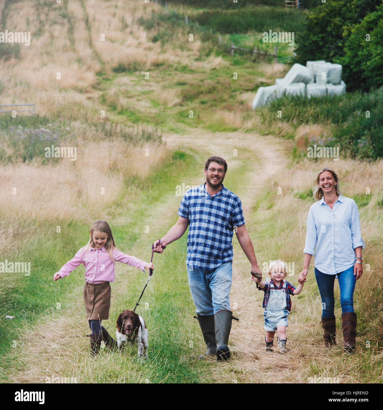 Family Walking Dog Togetherness Nature Concept Stock Photo - Alamy