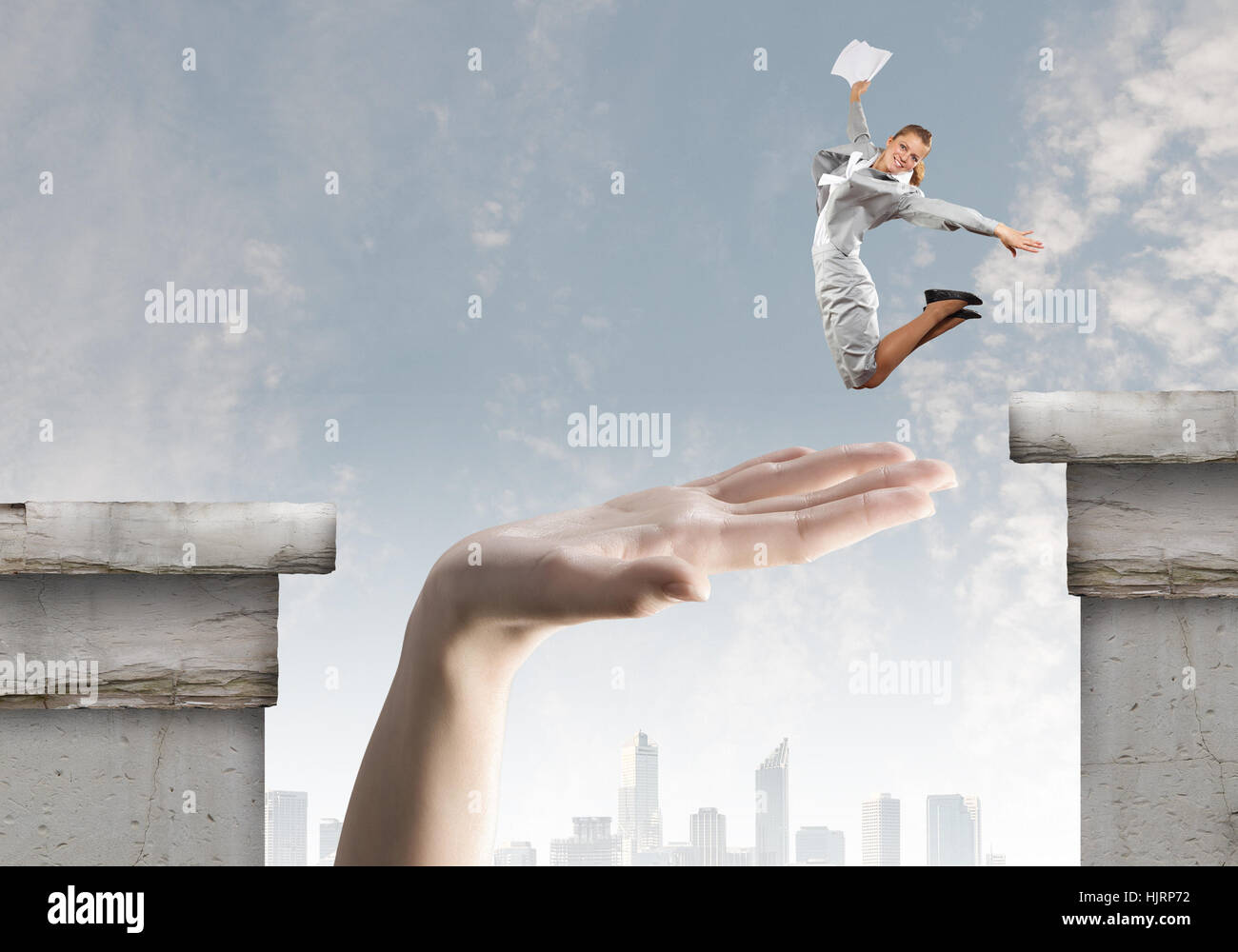 Businesswoman jumping over gap. Risk and challenge concept Stock Photo ...
