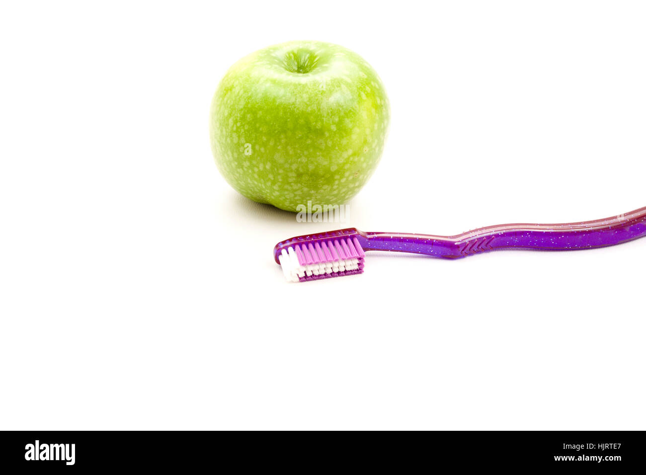 green apple with toothbrush Stock Photo - Alamy