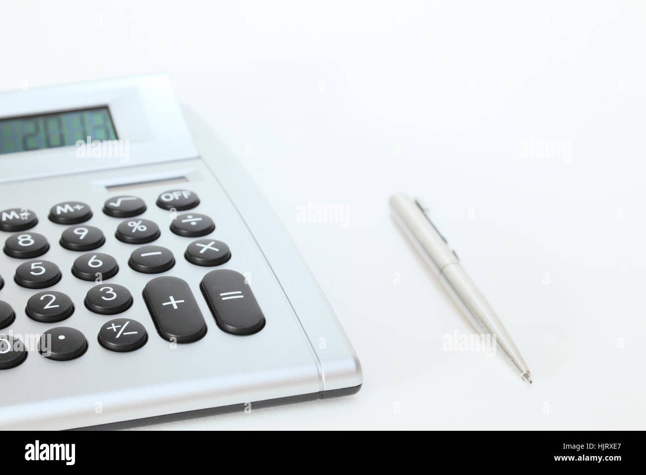 calculator with pen Stock Photo - Alamy