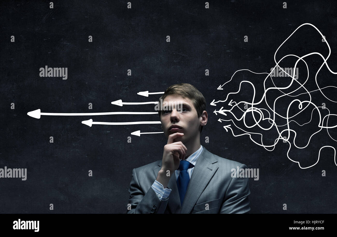 Thoughtful businessman with arrows and thoughts coming out of his head ...
