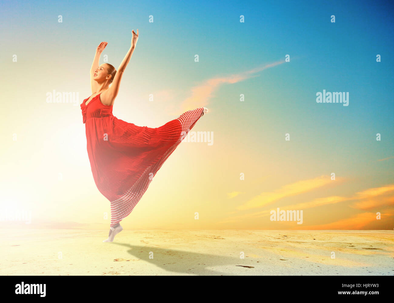 Image of female ballet dancing on coast against sunset background hi ...
