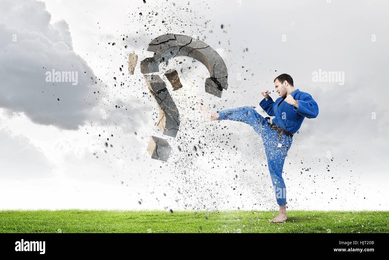 Young determined karate man breaking hi-res stock photography and ...